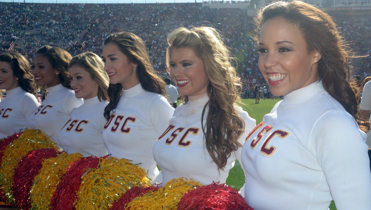 Spirited NCAA football cheerleaders around the country