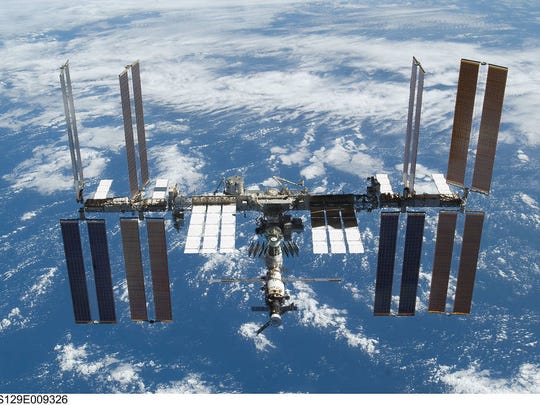 Striking photo shows space station passing sun