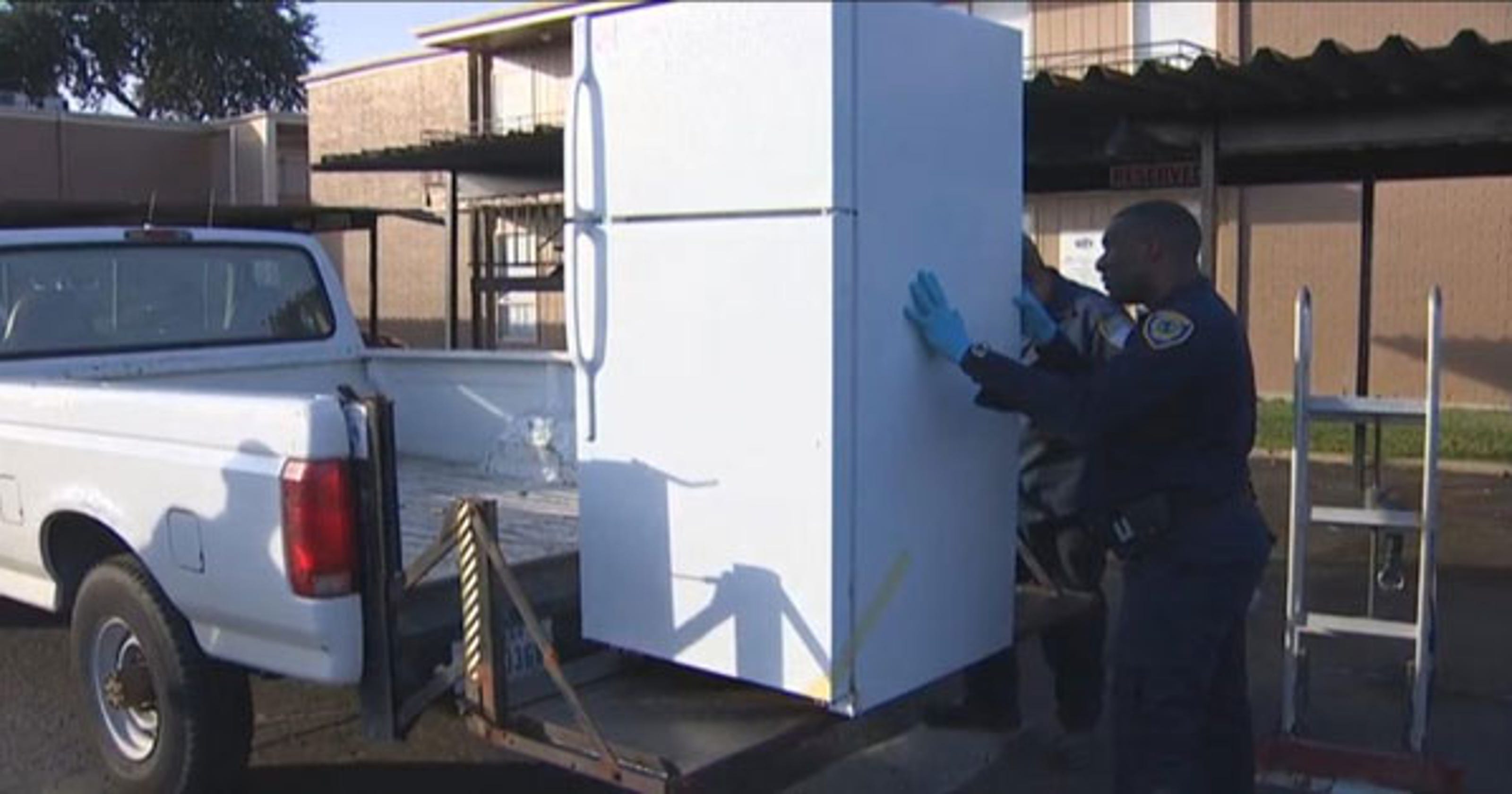 Search continues for baby of woman found in refrigerator