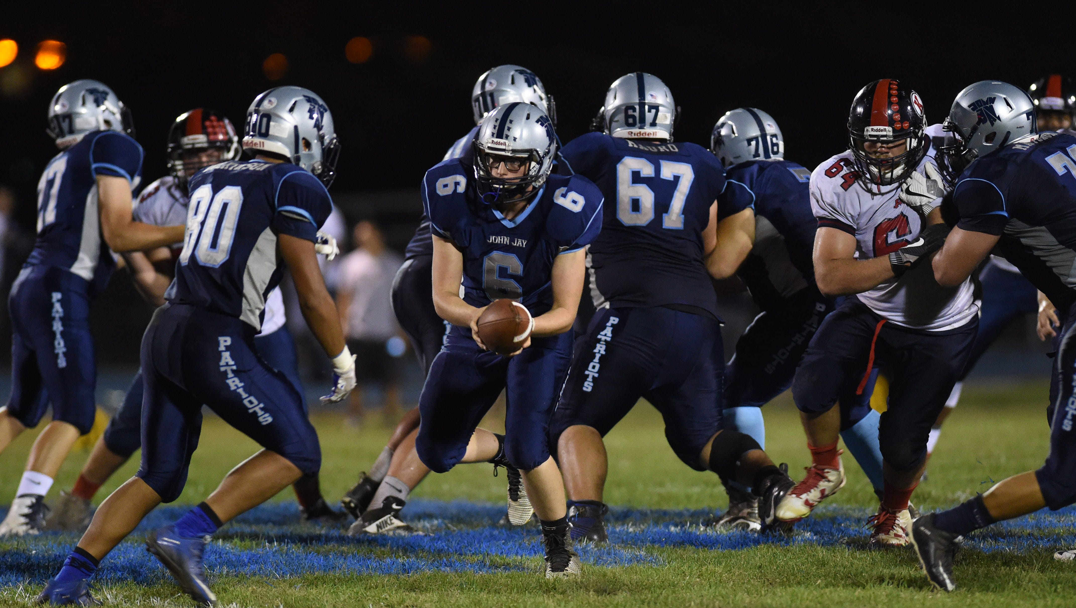 Football's 'Big guys' help 'skinny kids' take spotlight