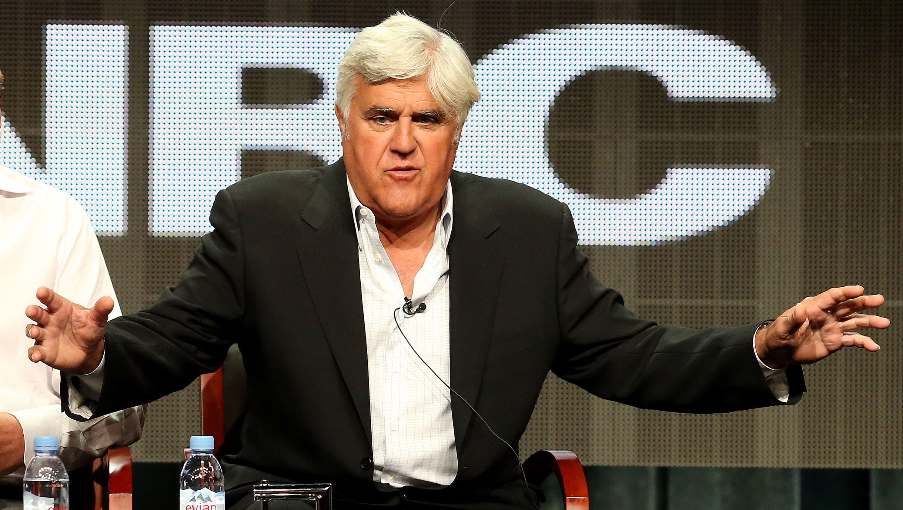 Watch Jay Leno walk away from a terrifying stunt car crash
