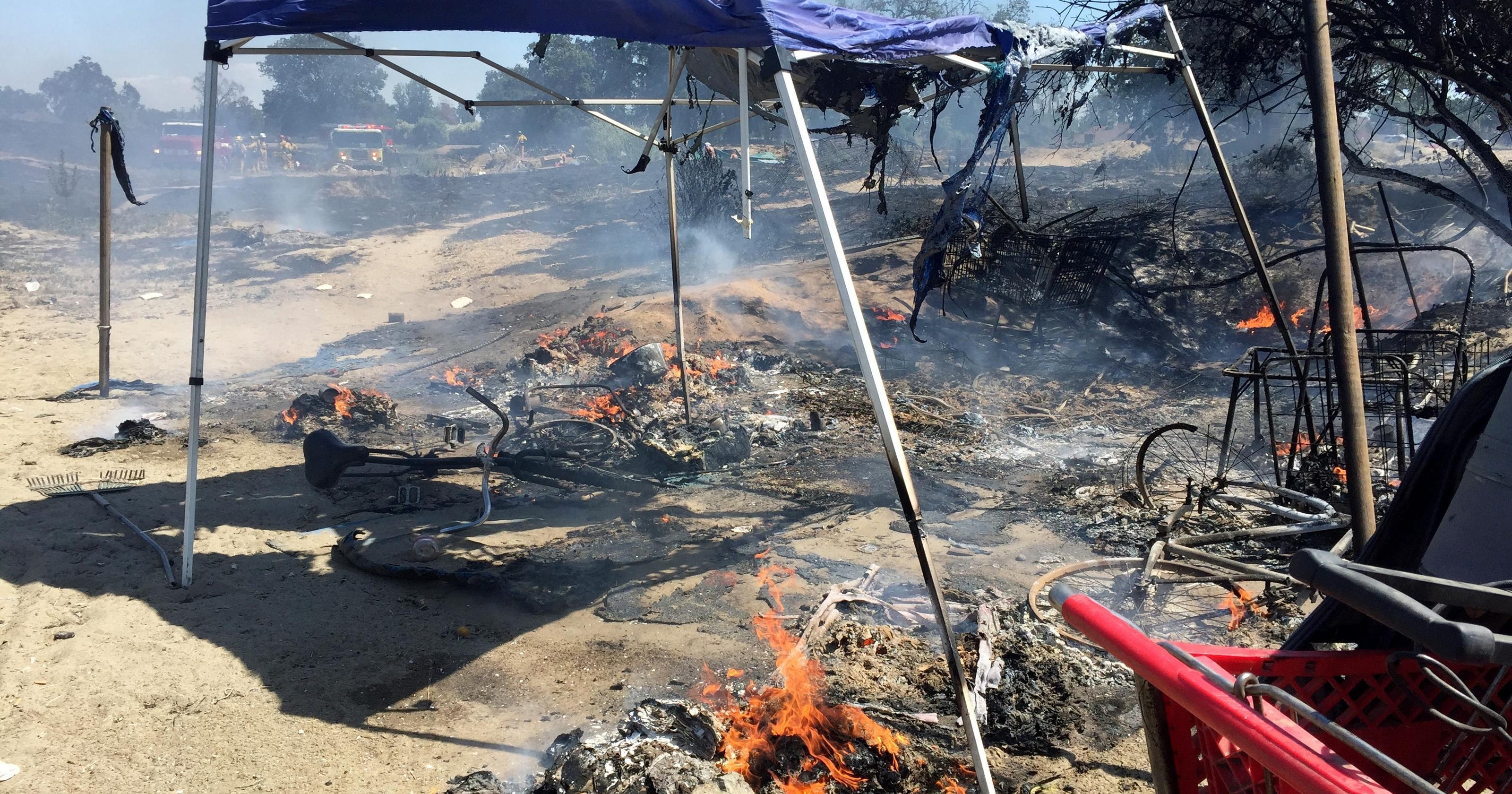 Fire burns through homeless camp