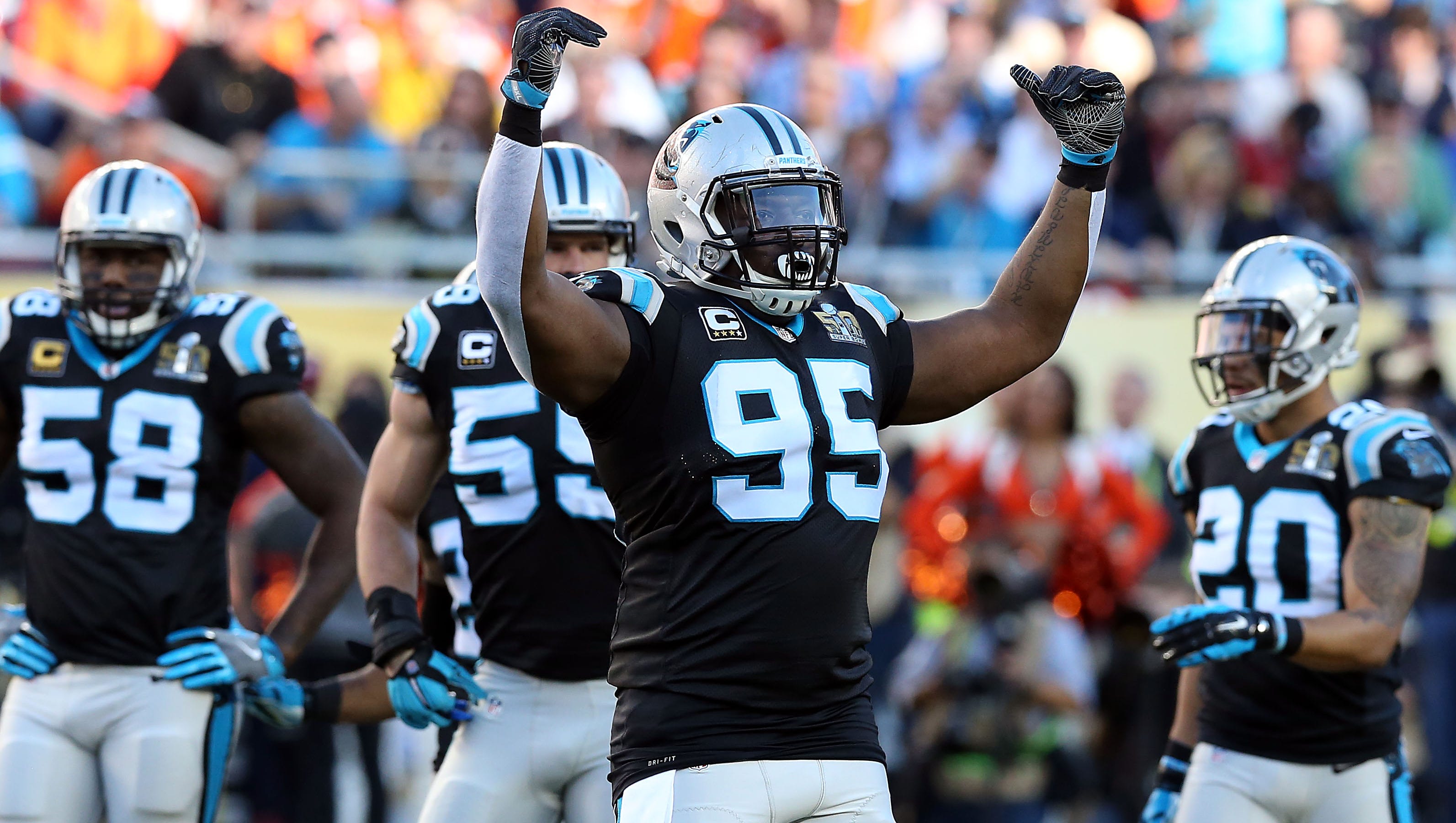 Panthers release DE Johnson, DT Edwards, re-sign OL Scott