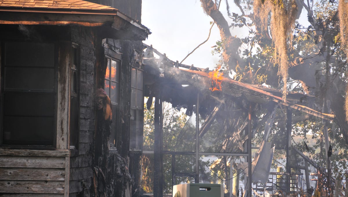 Photos: Fire on Tropical Trail home on Merritt Island