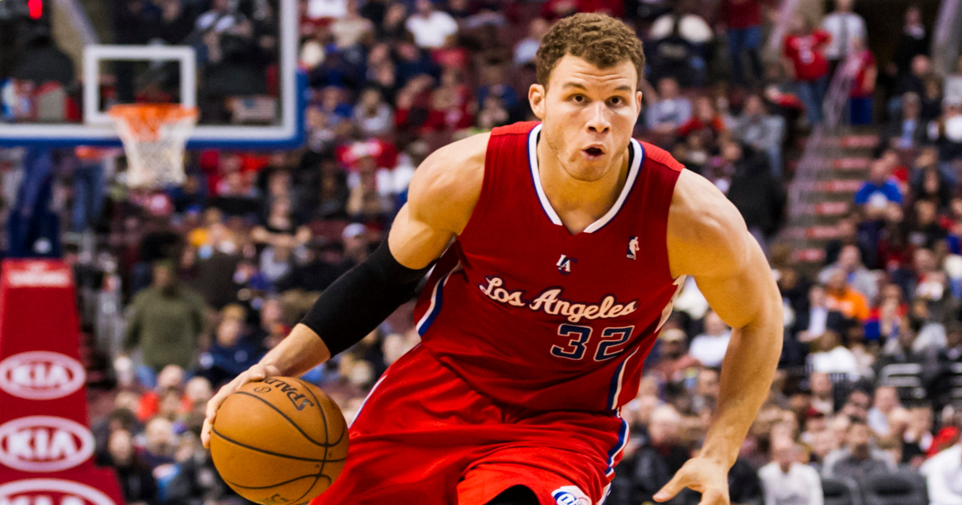 Blake Griffin unleashes acrobatic dunk on Spencer Hawes