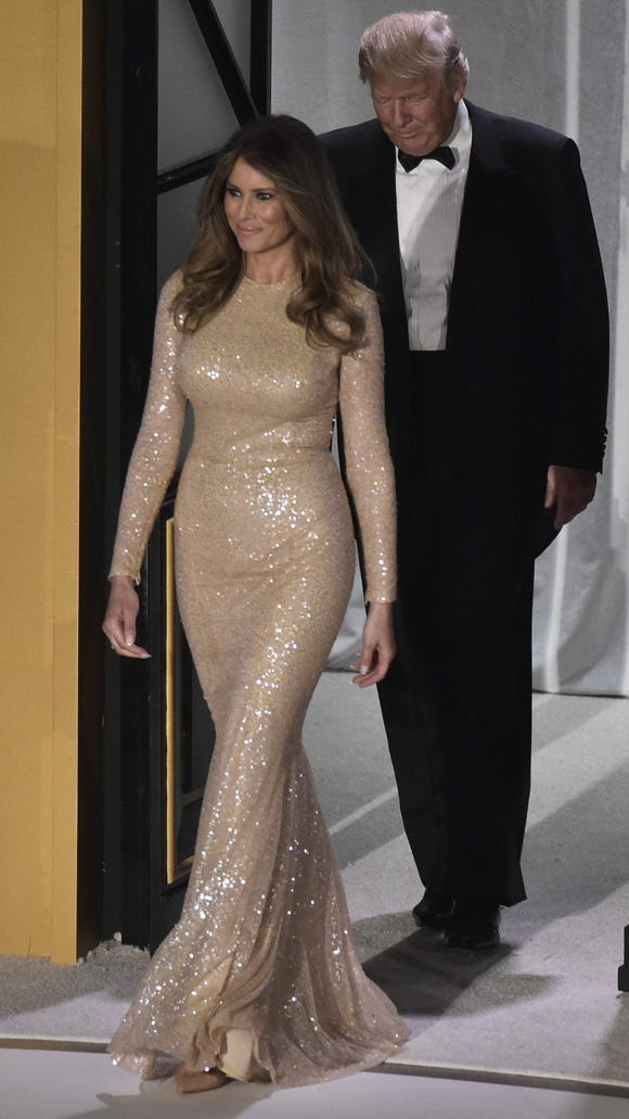 Melania Trump dons gold on eve of inauguration
