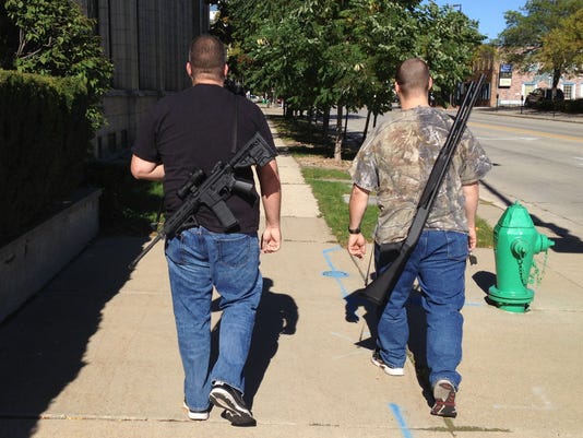Police stop 2 men carrying firearms in Wis. downtown