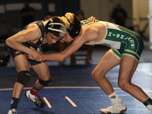 League champions crowned in boys wrestling