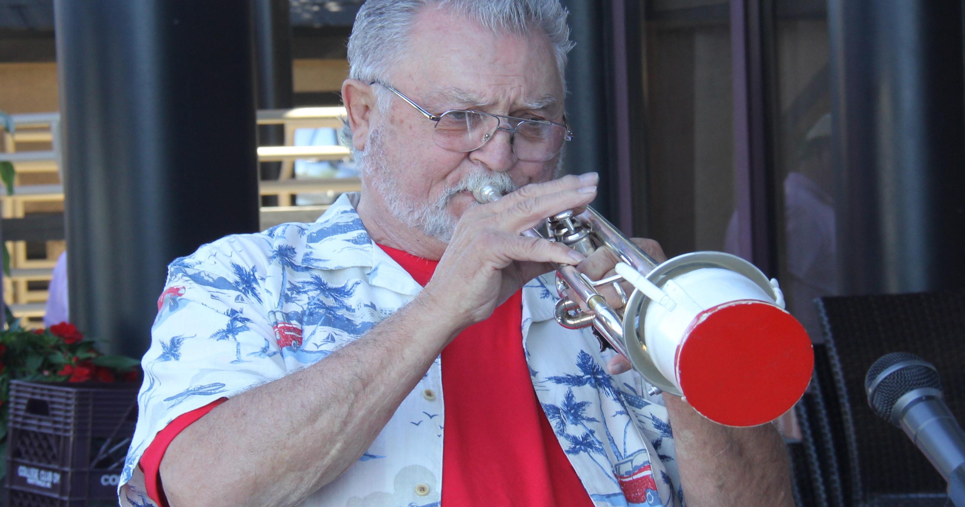 Larry Getz plays his trumpet softly for dinnertime