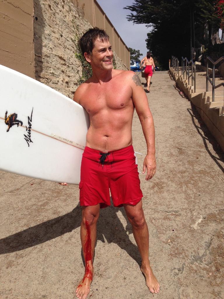 Rob Lowe shows off fit pecs, bloody leg after surfing