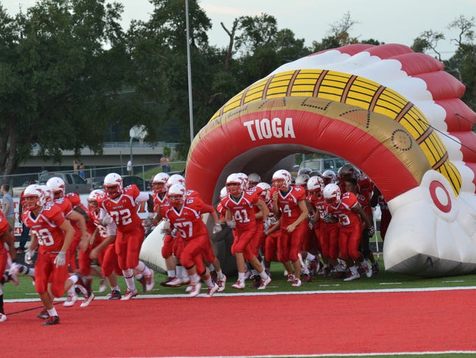 The Tioga Indians take the field Friday, Sept. 26, 2014, as they take ...