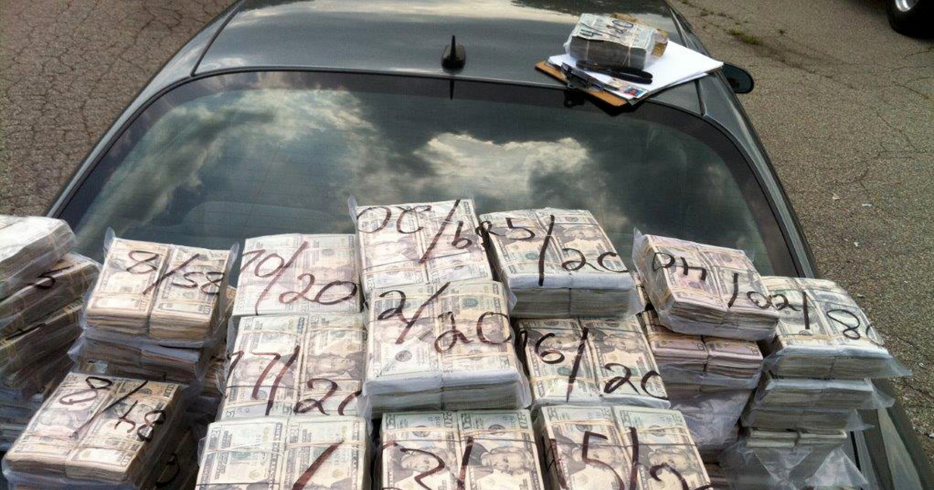 Feds: Corrupt Detroit cop threw money at strippers, hair doc, cars