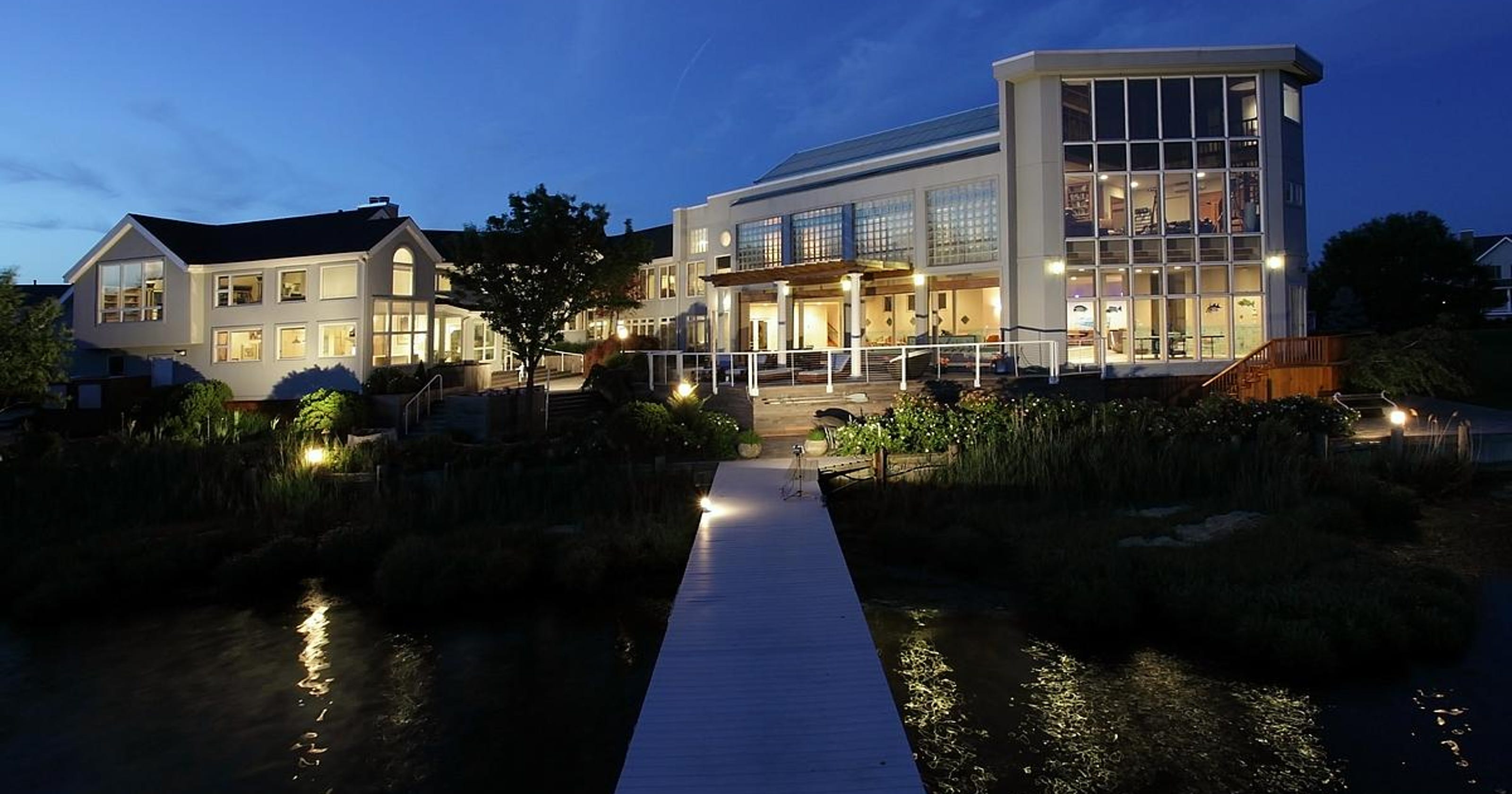 $3.2 million mansion has palatial pool with glass doors