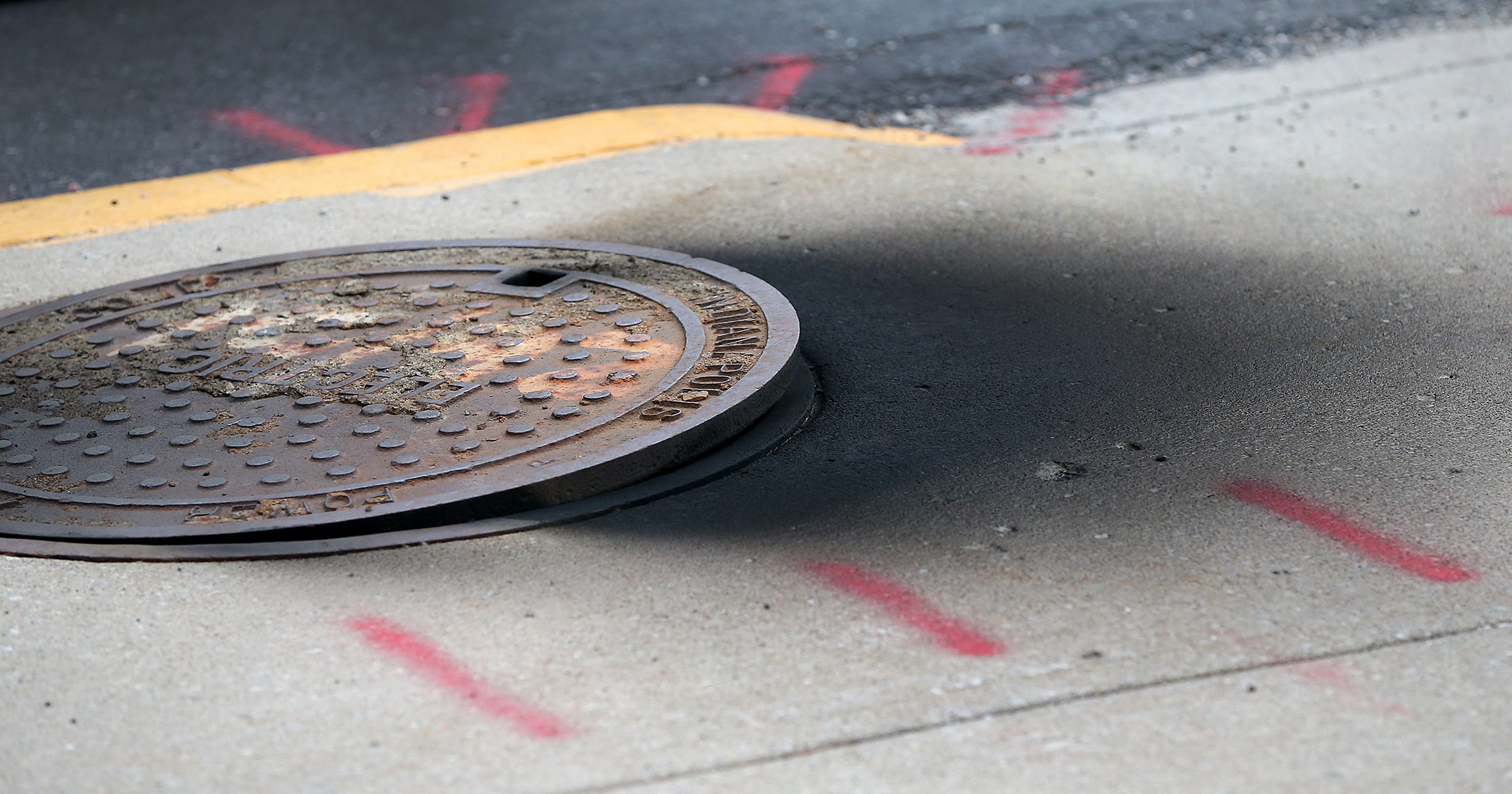 IPL to install manhole cover restraints Downtown