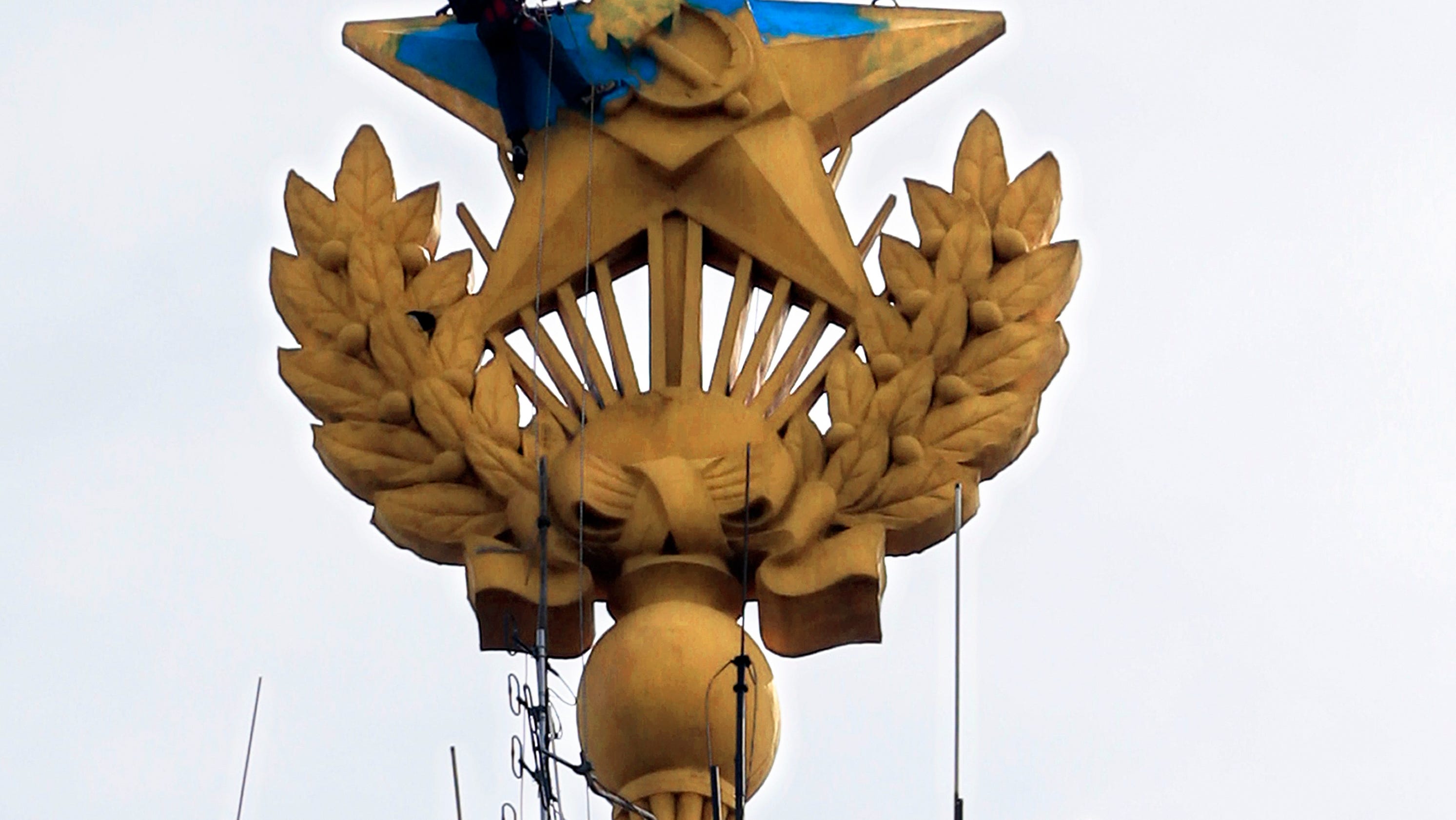 Activists plant Ukraine flag atop famous Moscow building