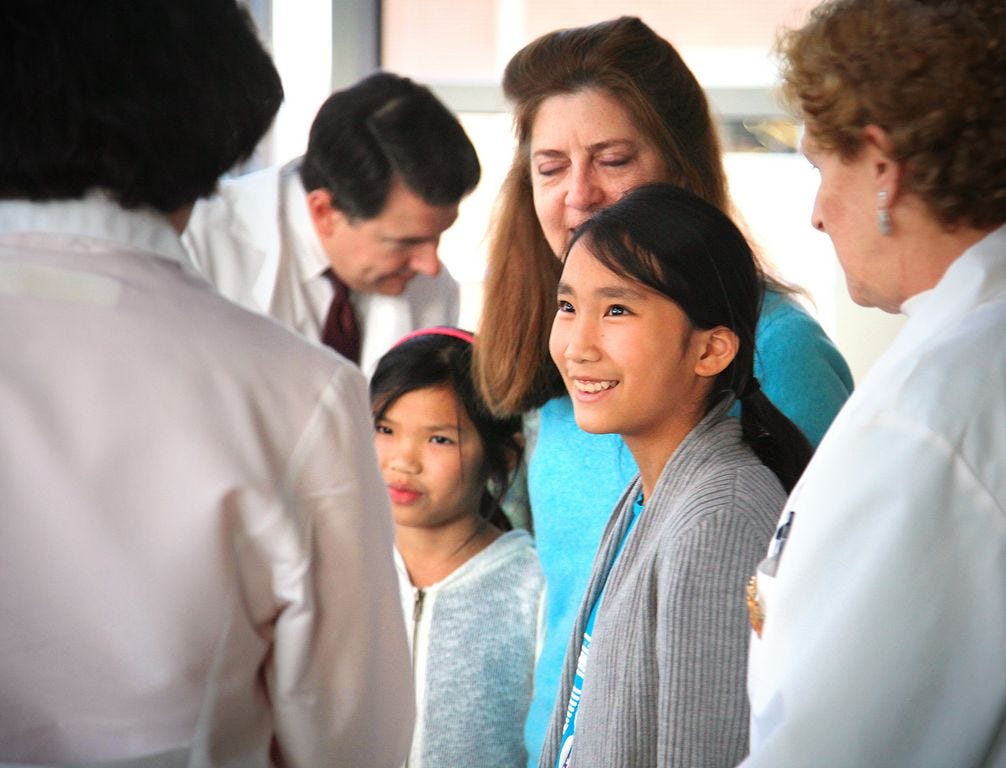 Scituate girls, 11 and 9, give to cancer center in dad’s memory