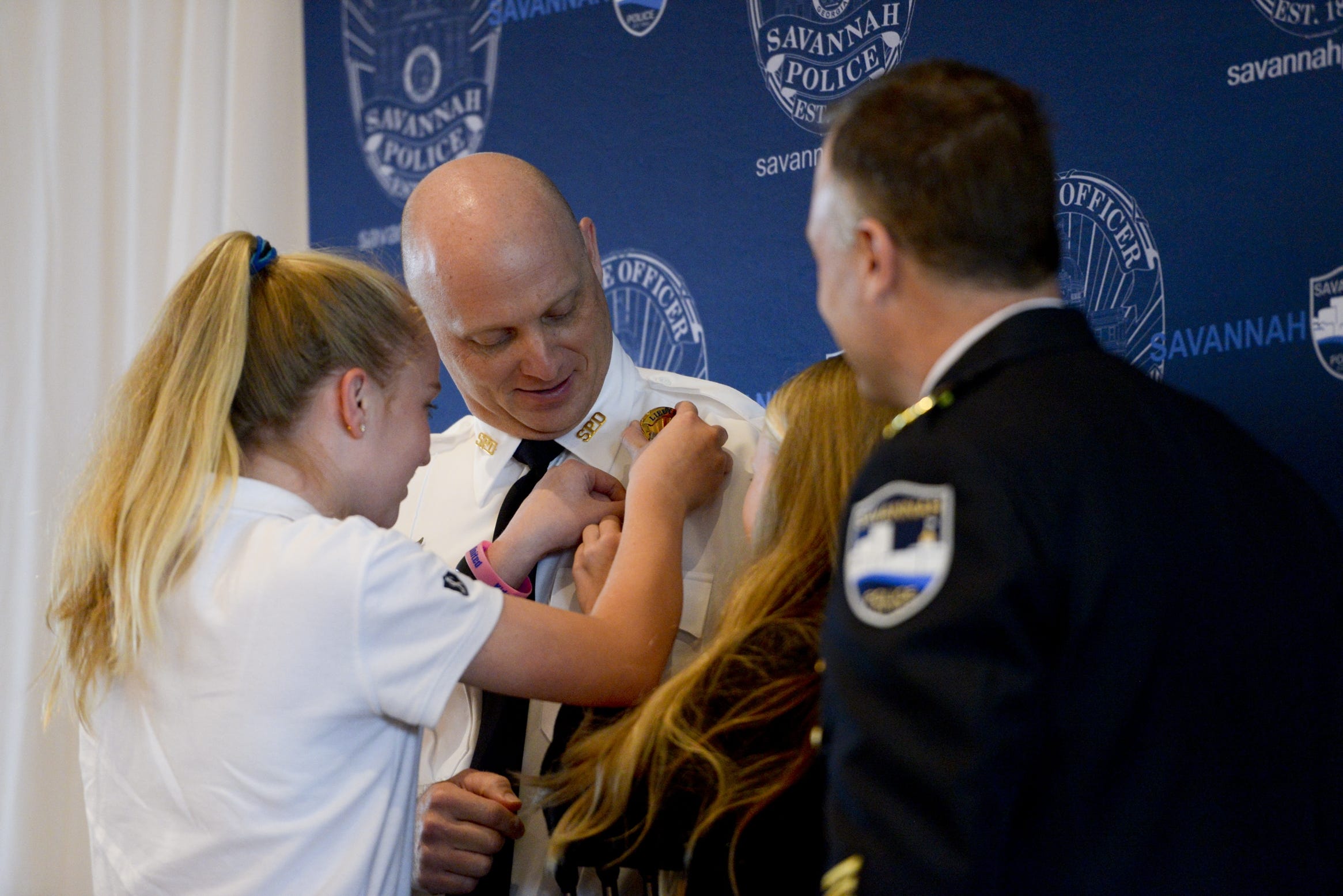 Savannah police promote 11 at badge pinning ceremony