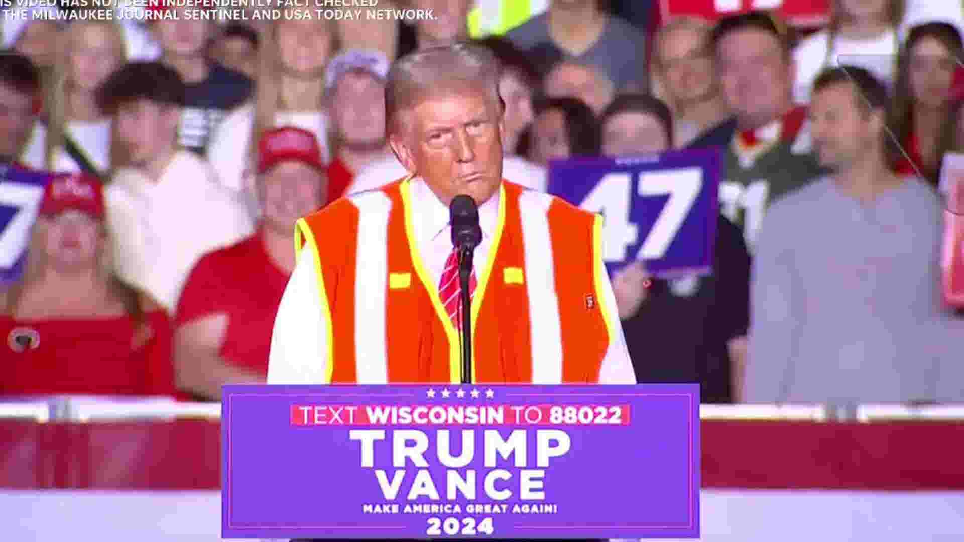 Donald Trump wears vest from MAGA garbage truck for Green Bay rally