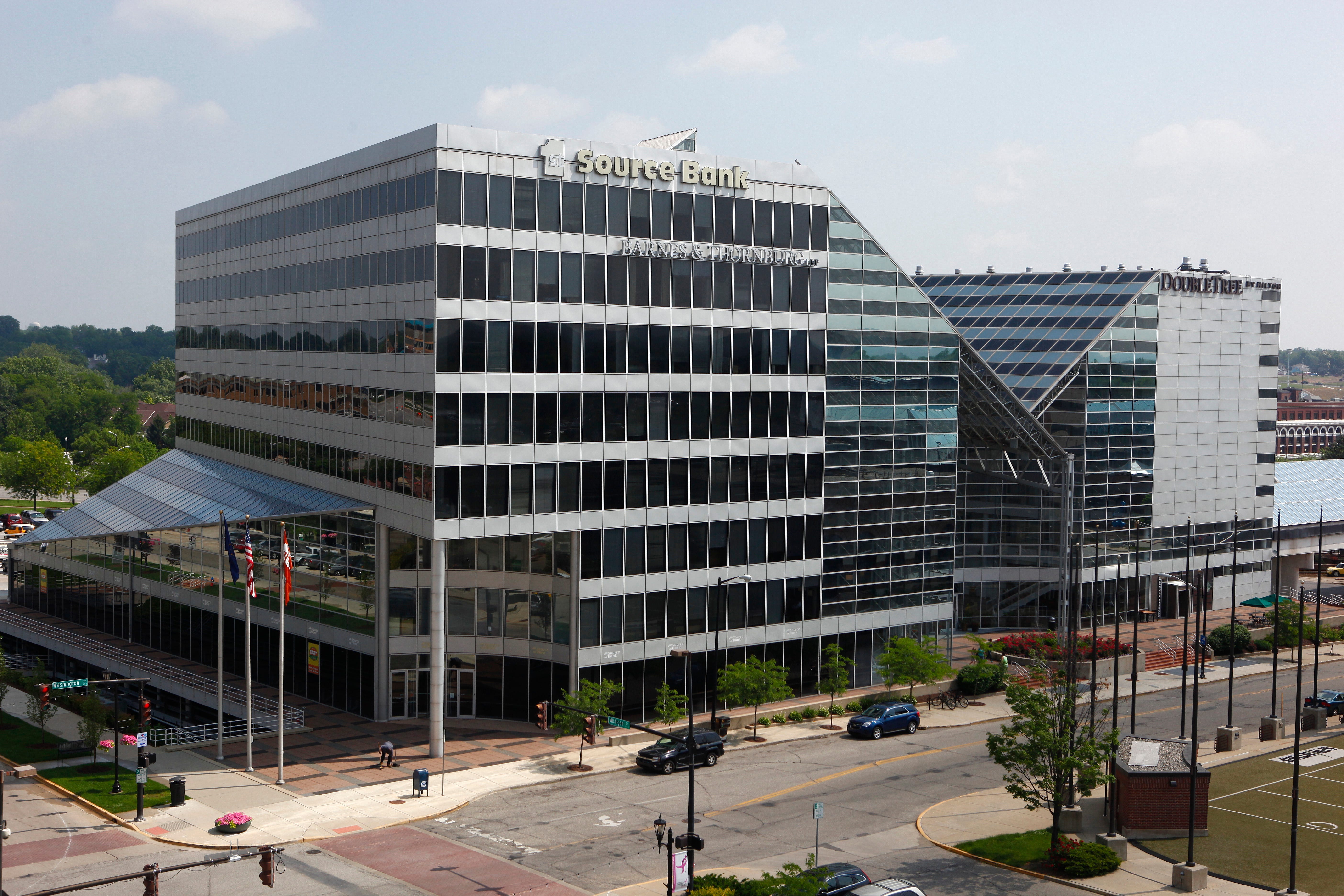 1st Source expanding