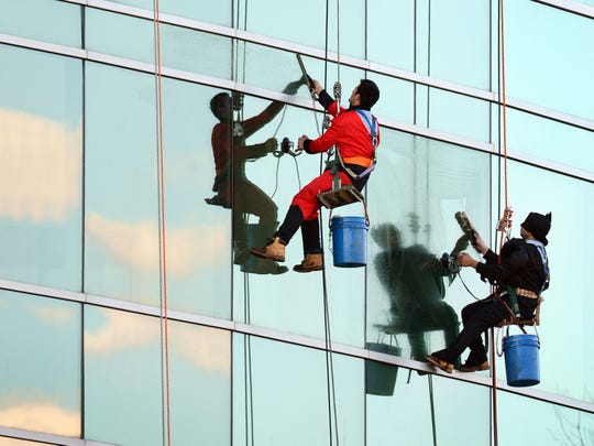 Superhero window washers surprise sick children