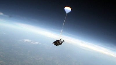 Record leap from edge of space gives skydiving a lift
