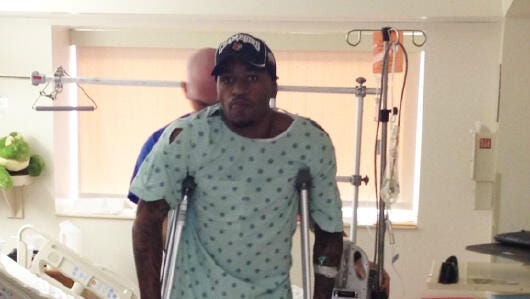 Louisville's Kevin Ware is moving around on crutches