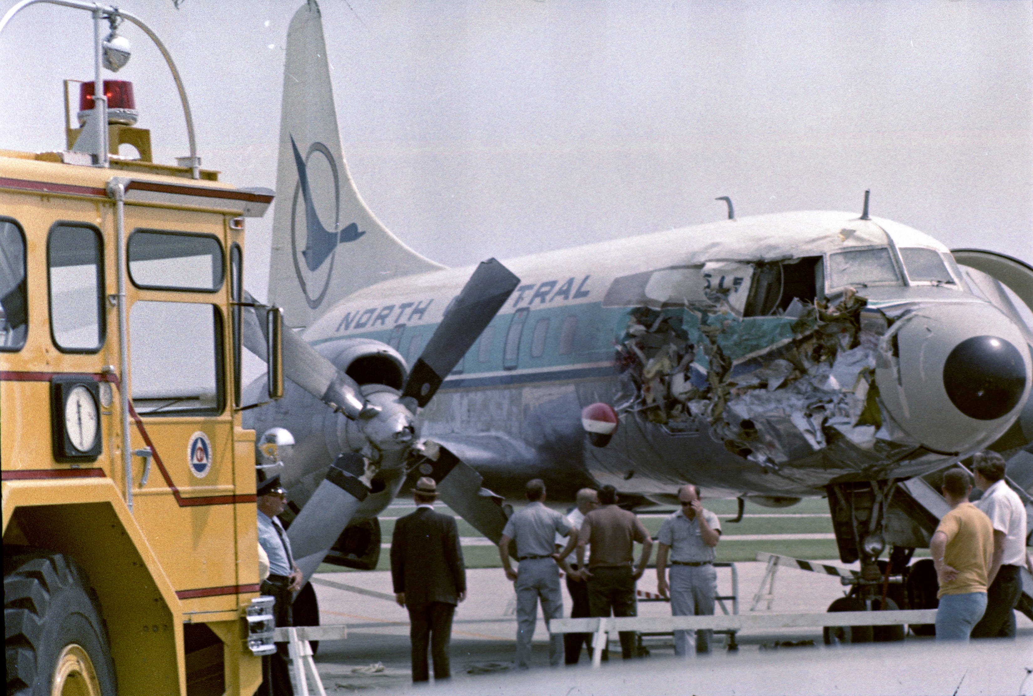 Planes collide in midair, one wedging into the other; pilot blames bugs