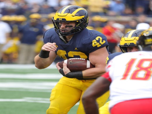 Michigan's Ben Mason hurdles his way into the highlights