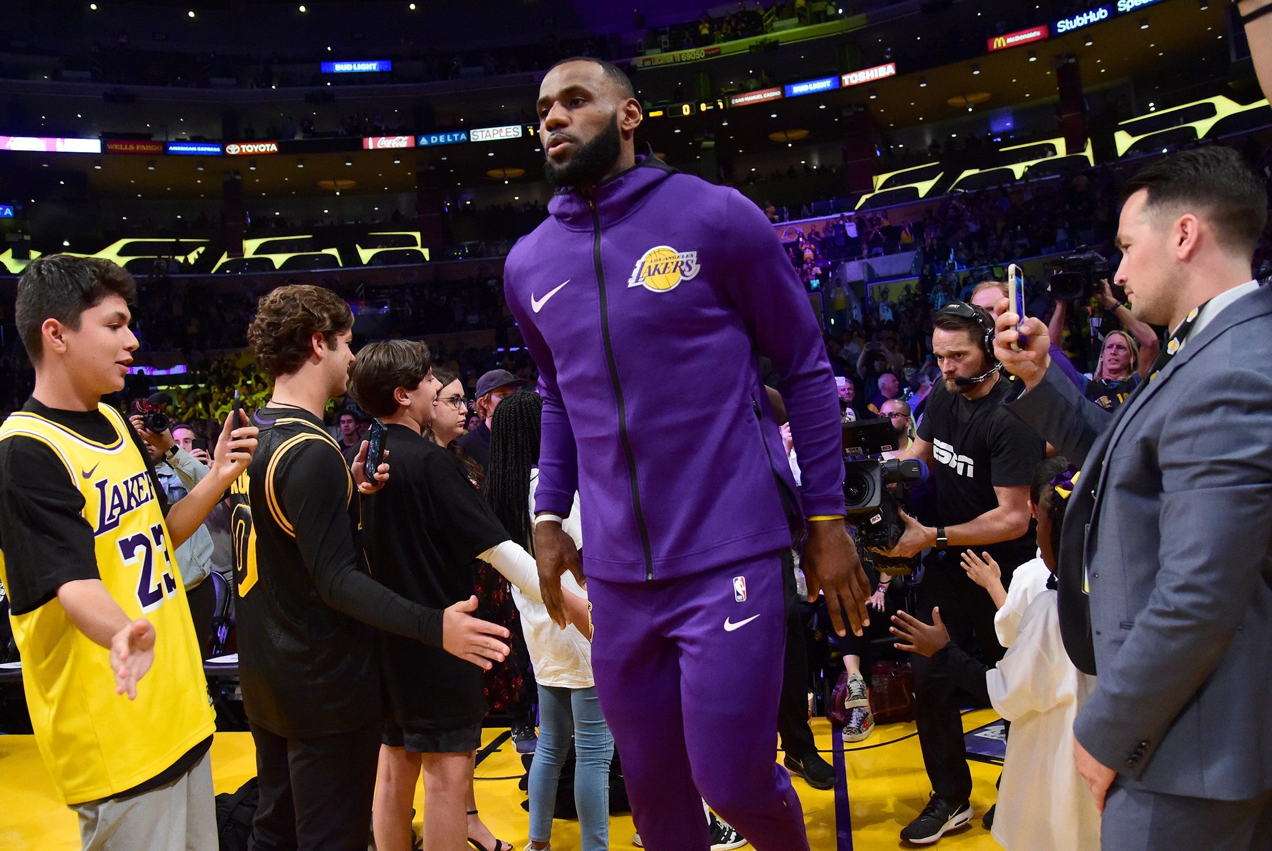 LeBron the brightest star among stars at Lakers home debut