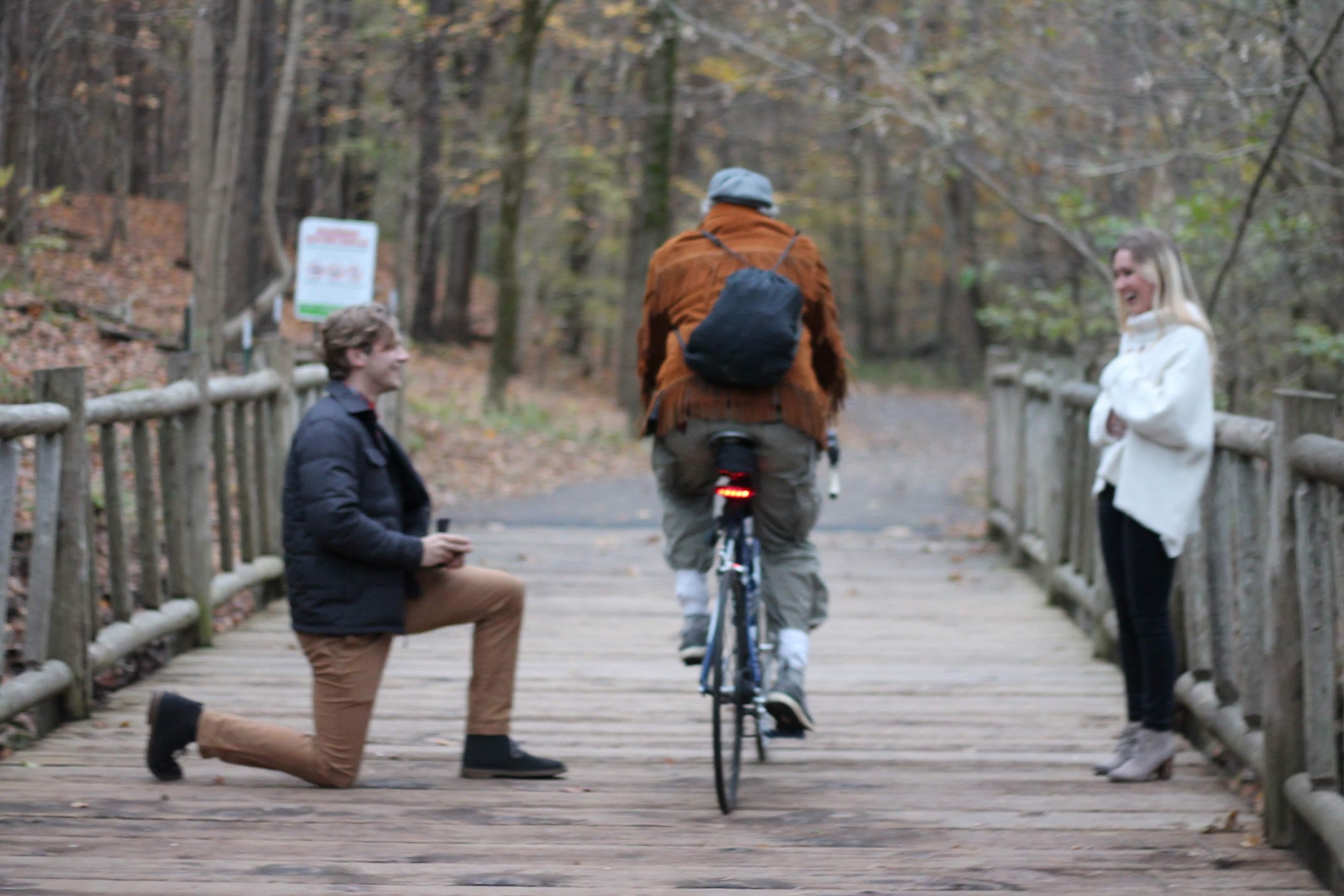 Louisville couple's proposal photobombed by man on a bike