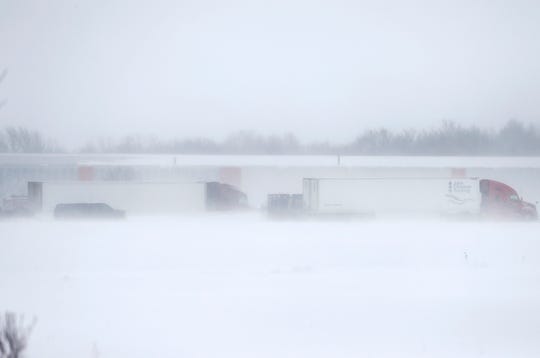 Wisconsin blizzard: Strong winds, power outages lead to travel woes