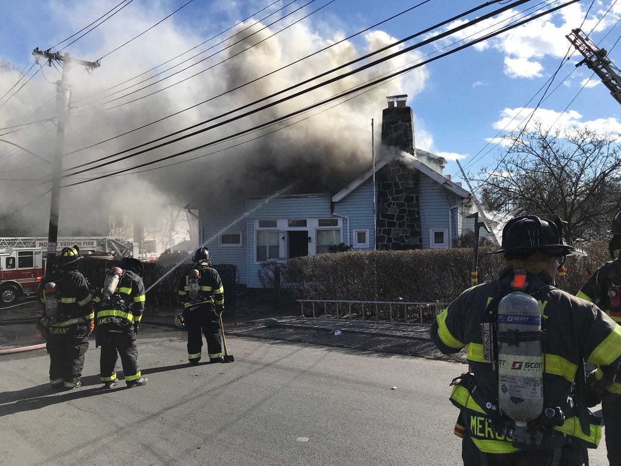Firefighters battle a smoky fire in Mount Vernon