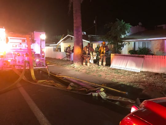 Firefighters rescue injured woman from Phoenix house fire
