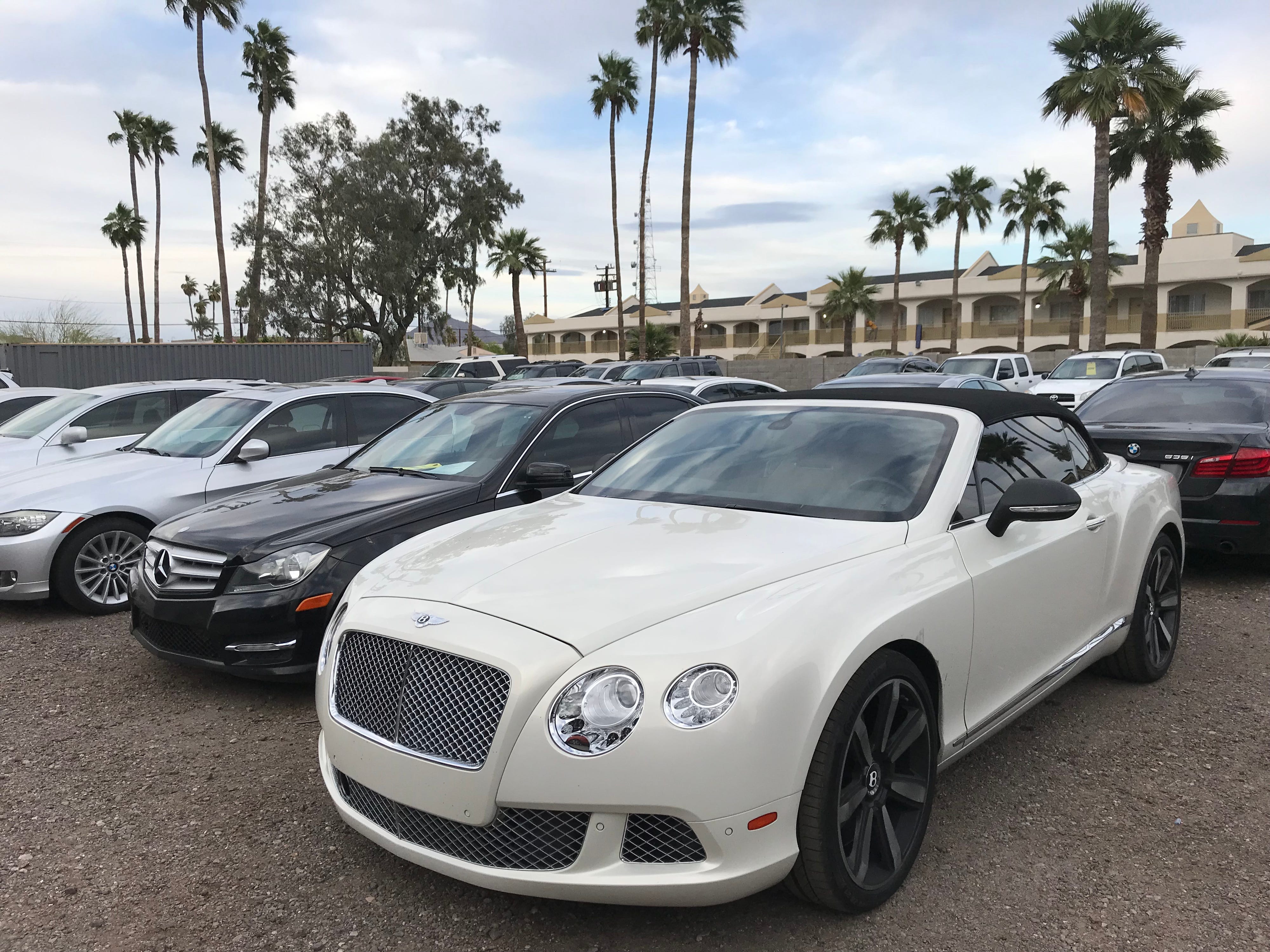 Arizona dealer didn't pay off trades or transfer title to used-car buyers