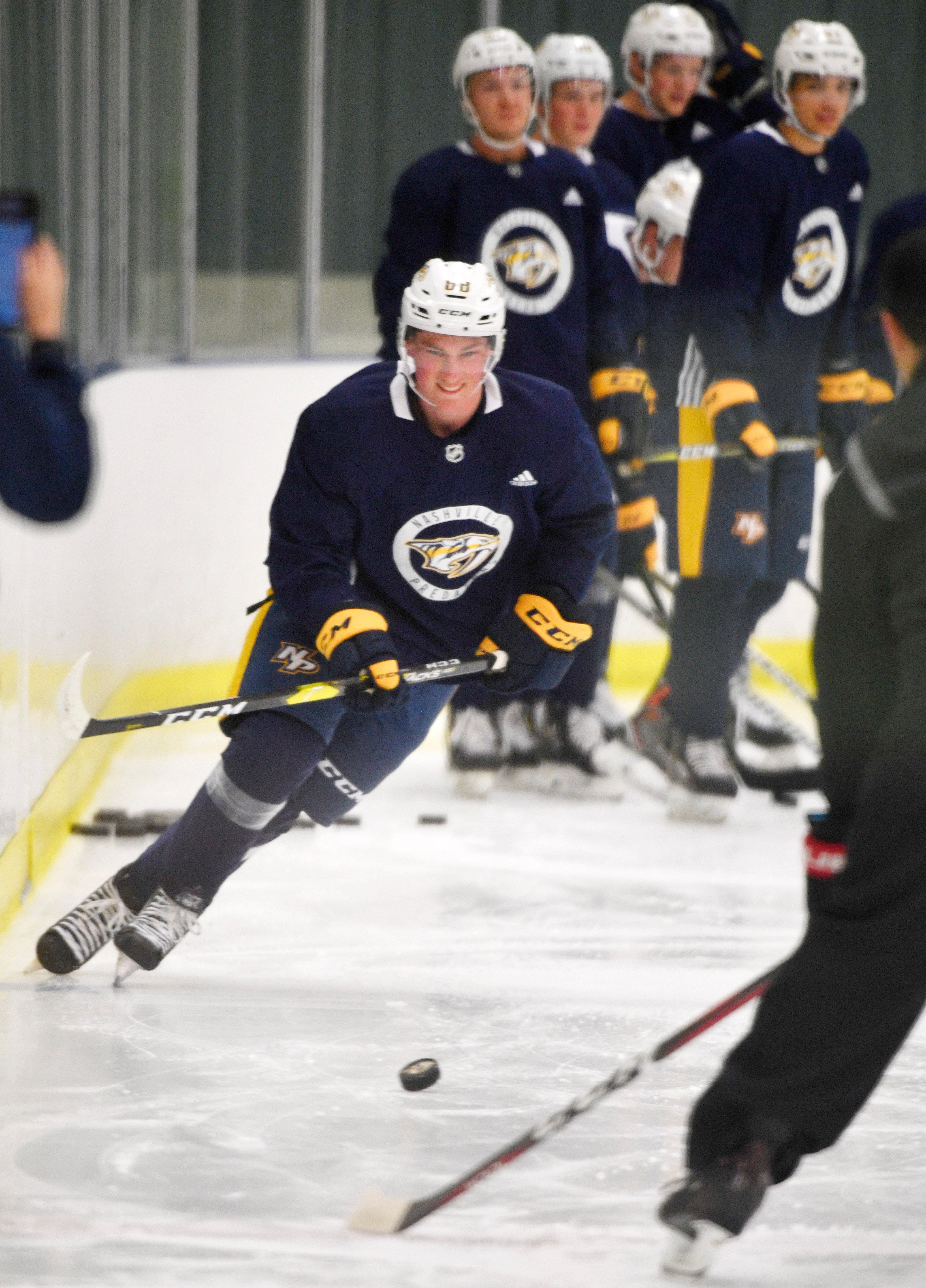 Nashville Predators rookie Philip Tomasino sits after making debut