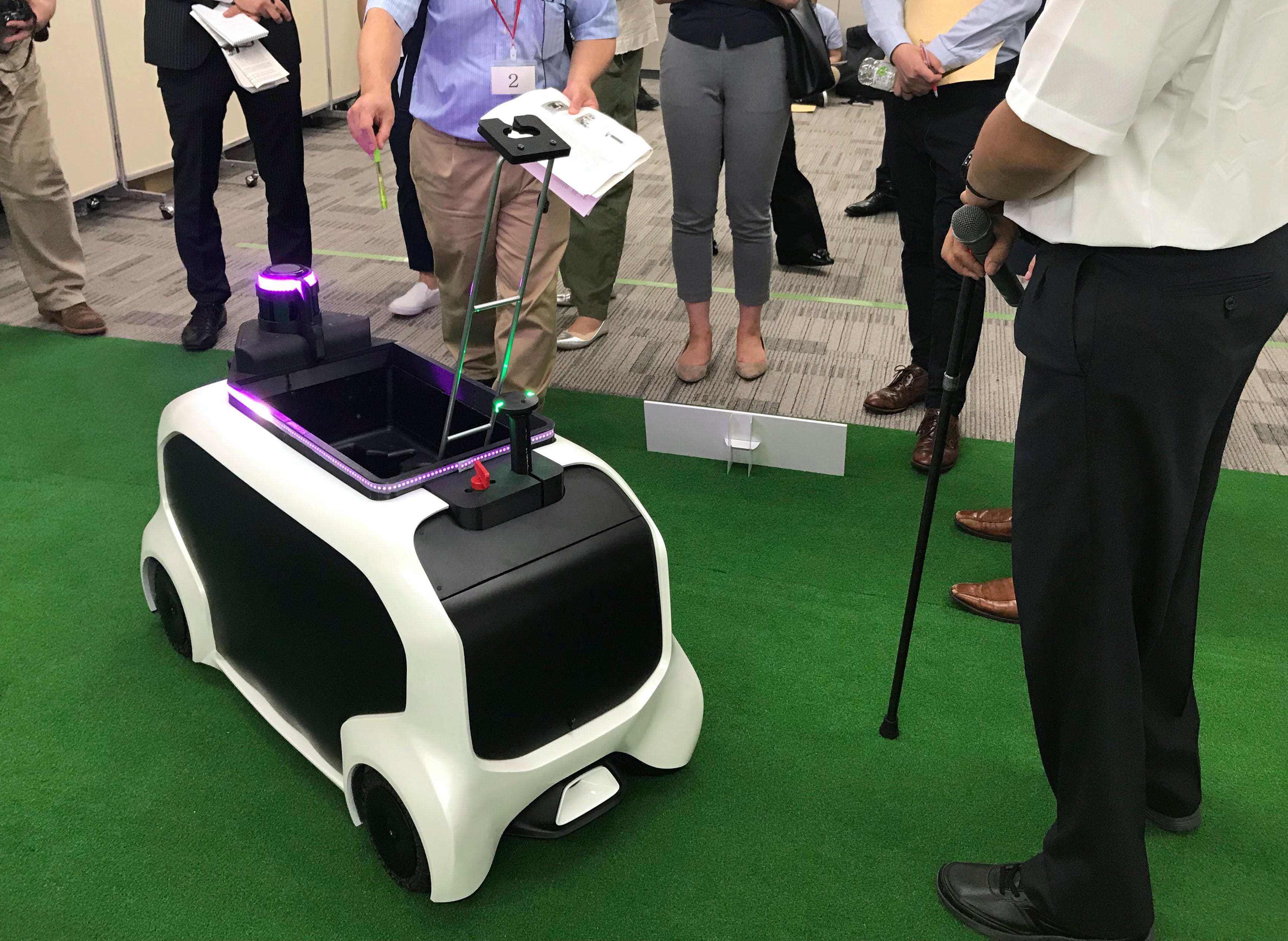 Olympic robots offer ‘virtual’ attendance, help out on field