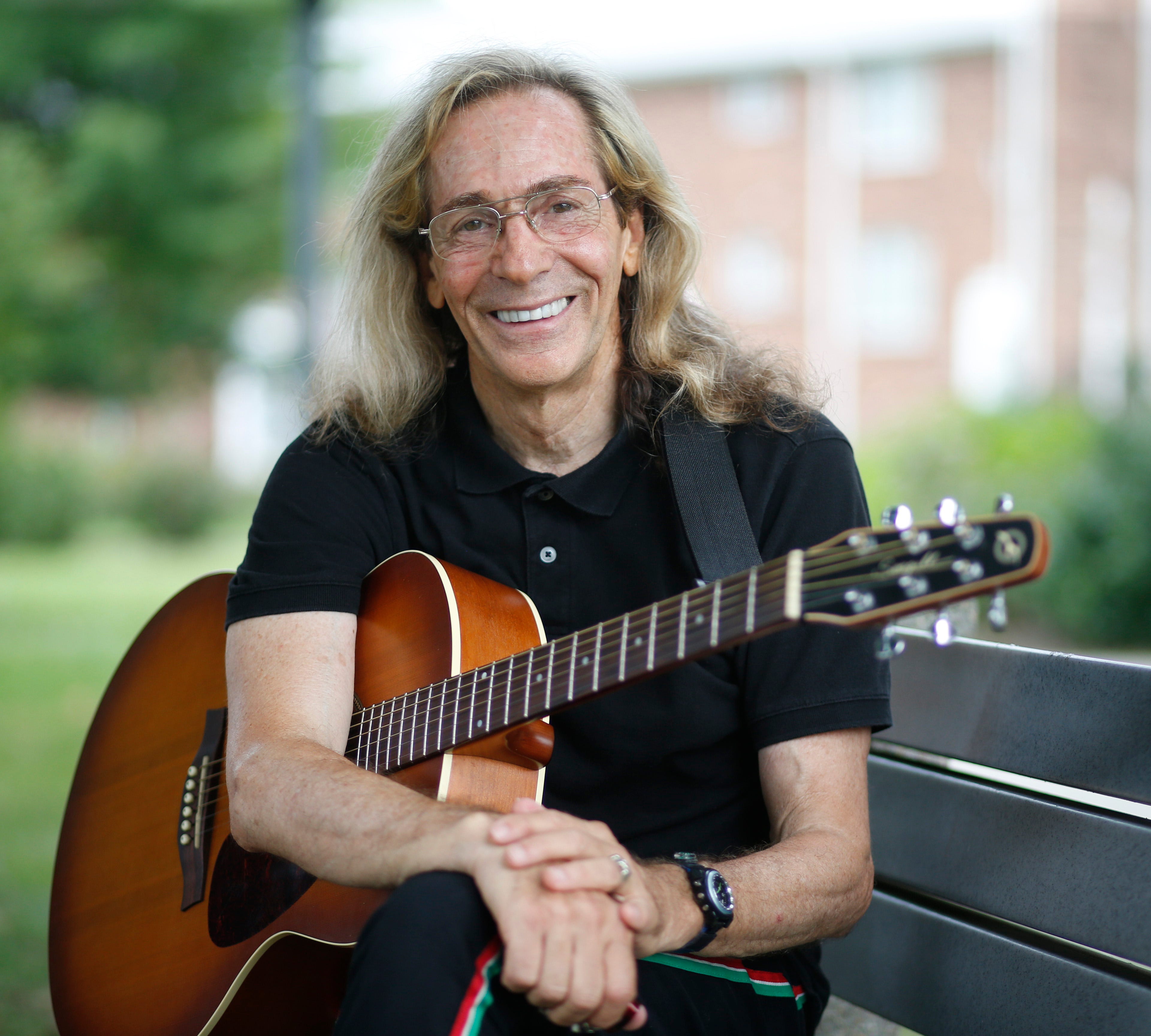 Teacher Mark Dema uses poetry, music to inspire students