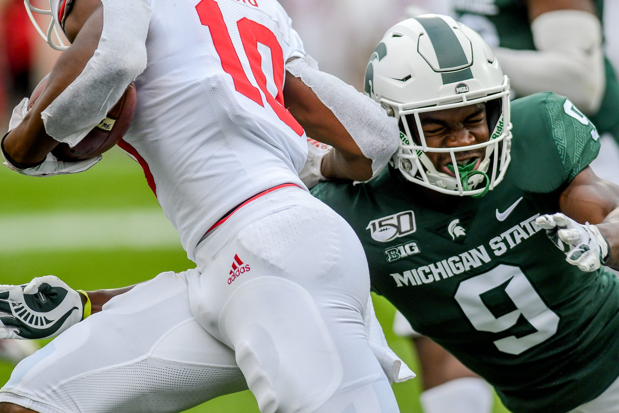 Michigan State football players doing what they can do work out