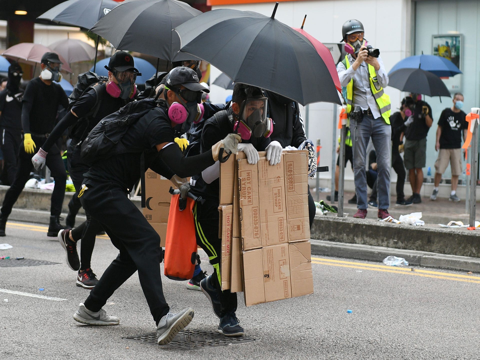 Hong Kong protesters clash with riot police as China marks 70 years of ...
