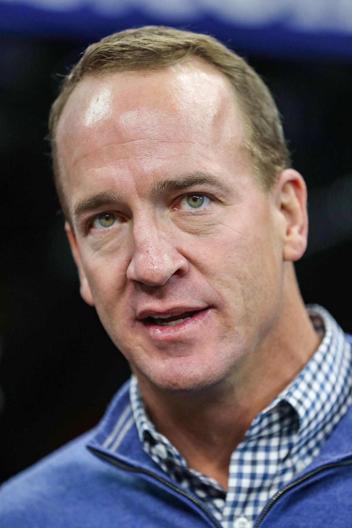 Former Colts quarterback Peyton Manning shows off arm at Denver Nuggets ...