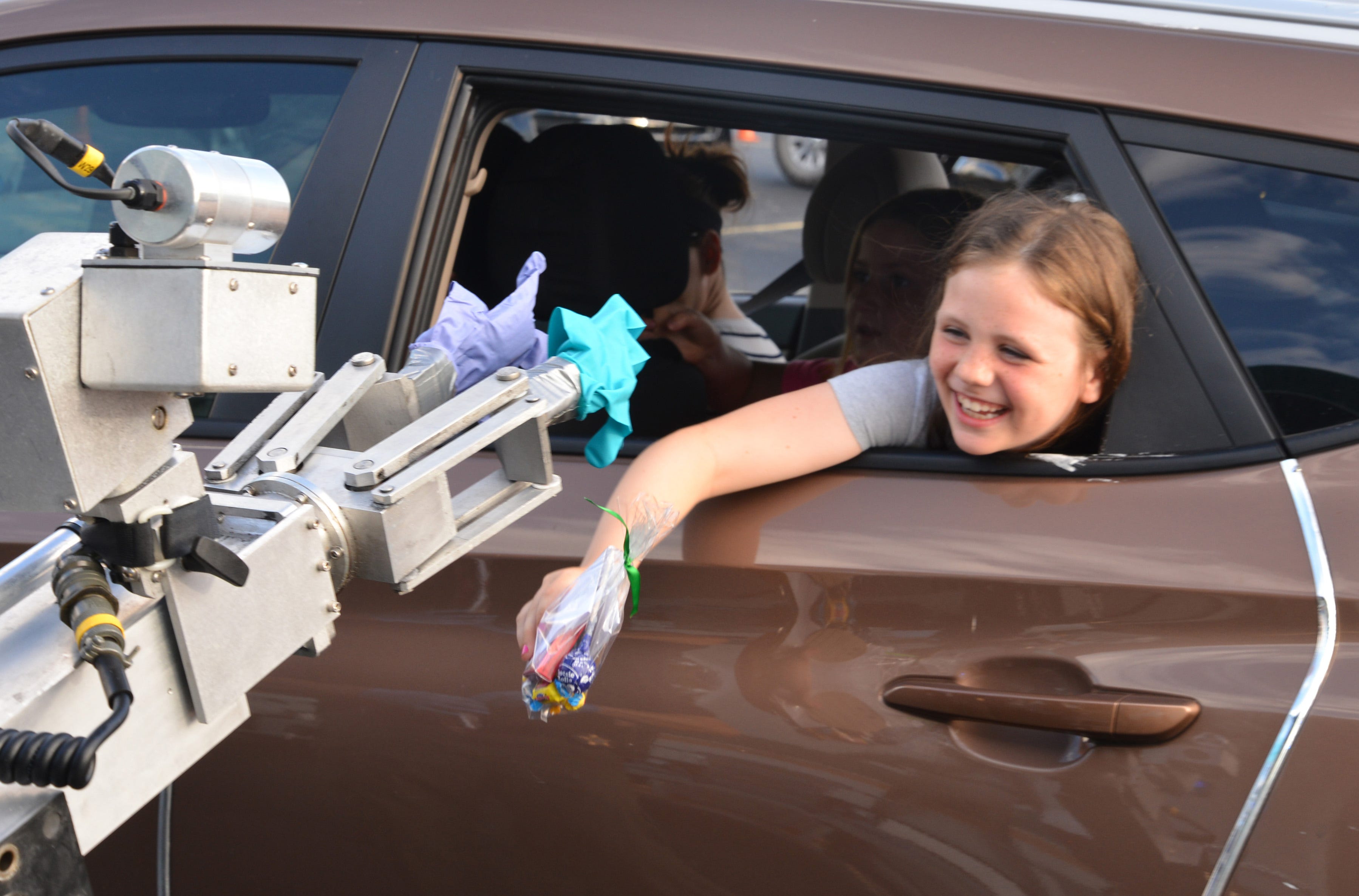 Florida held a drive-thru parade where a robot handed out candy
