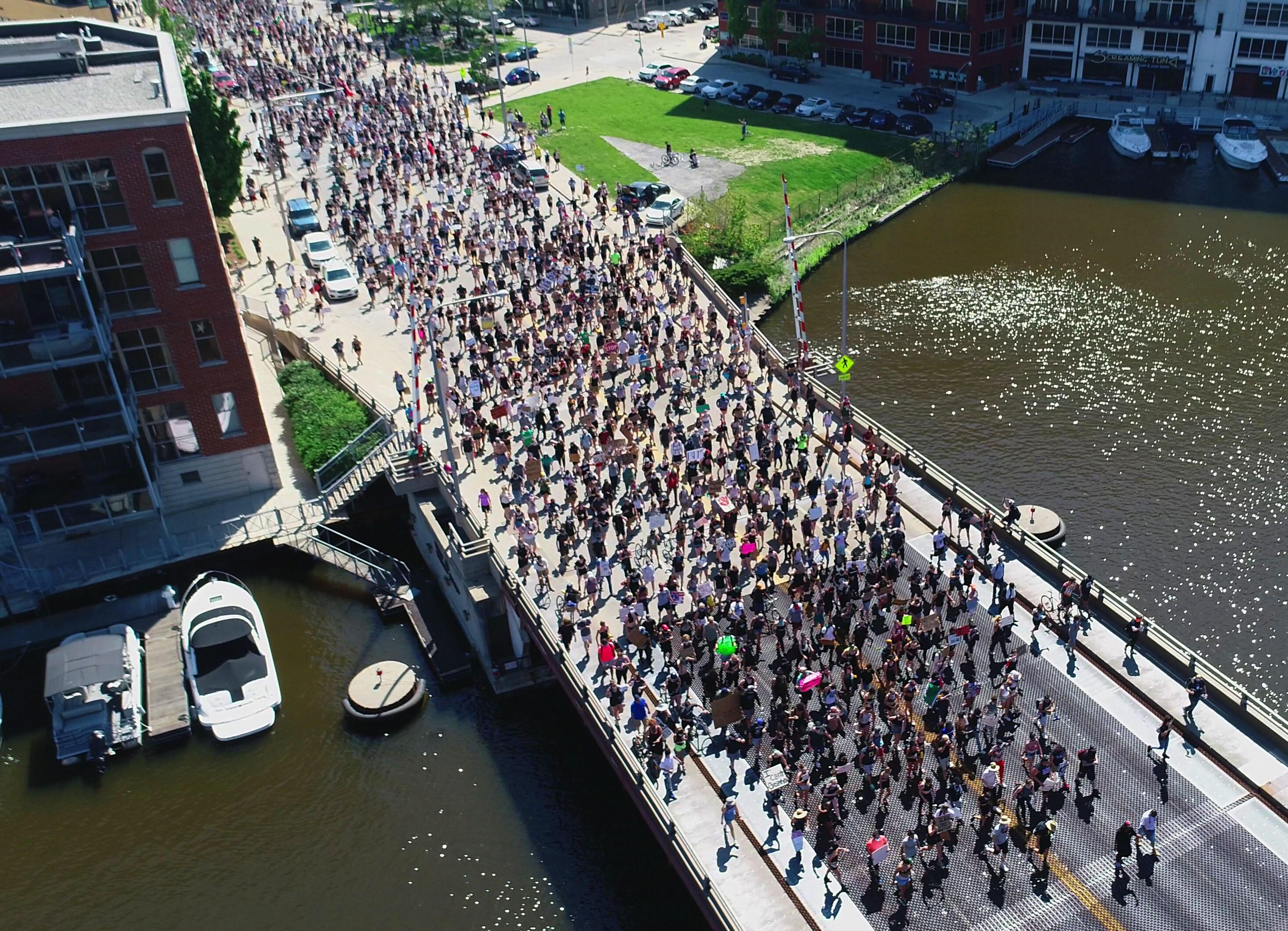 Drone view of peaceful protest march in Milwaukee against the killing ...