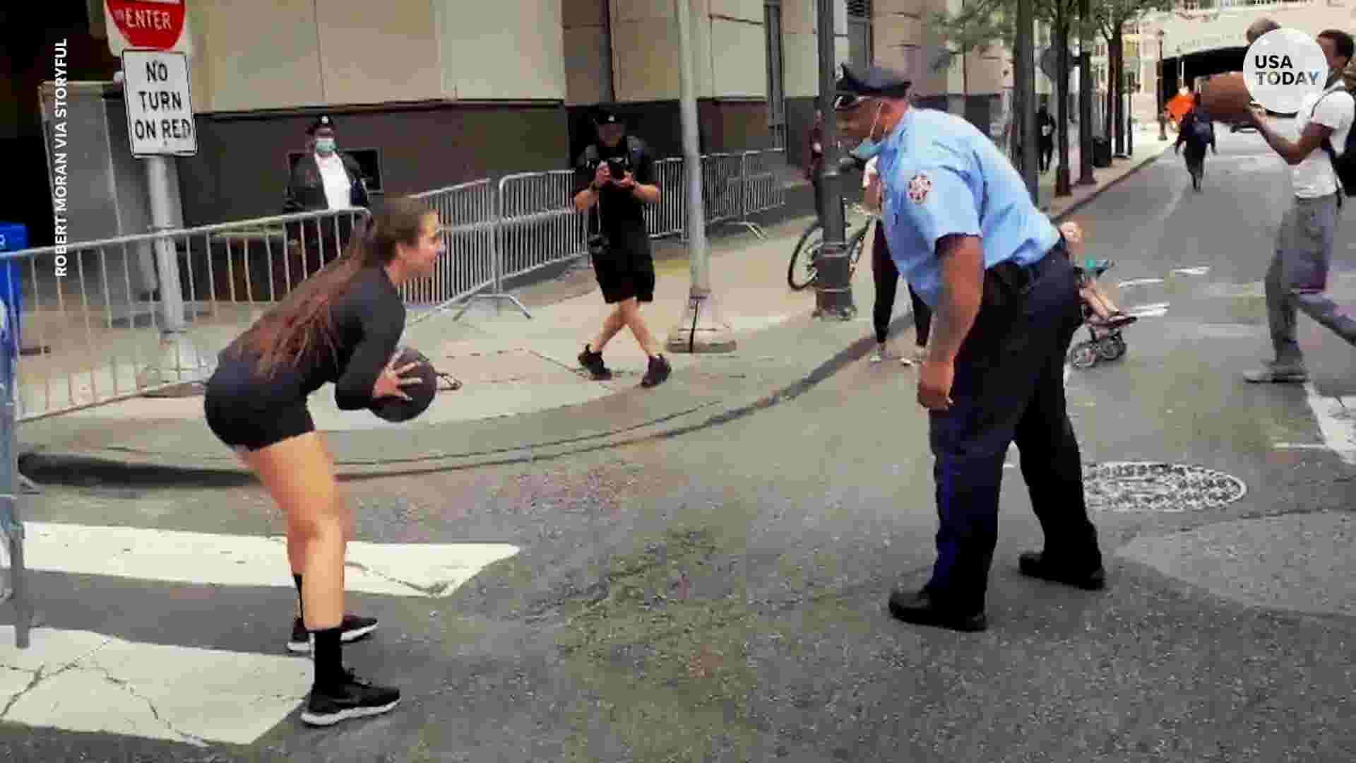Cop accepts fun basketball challenge during George Floyd protests