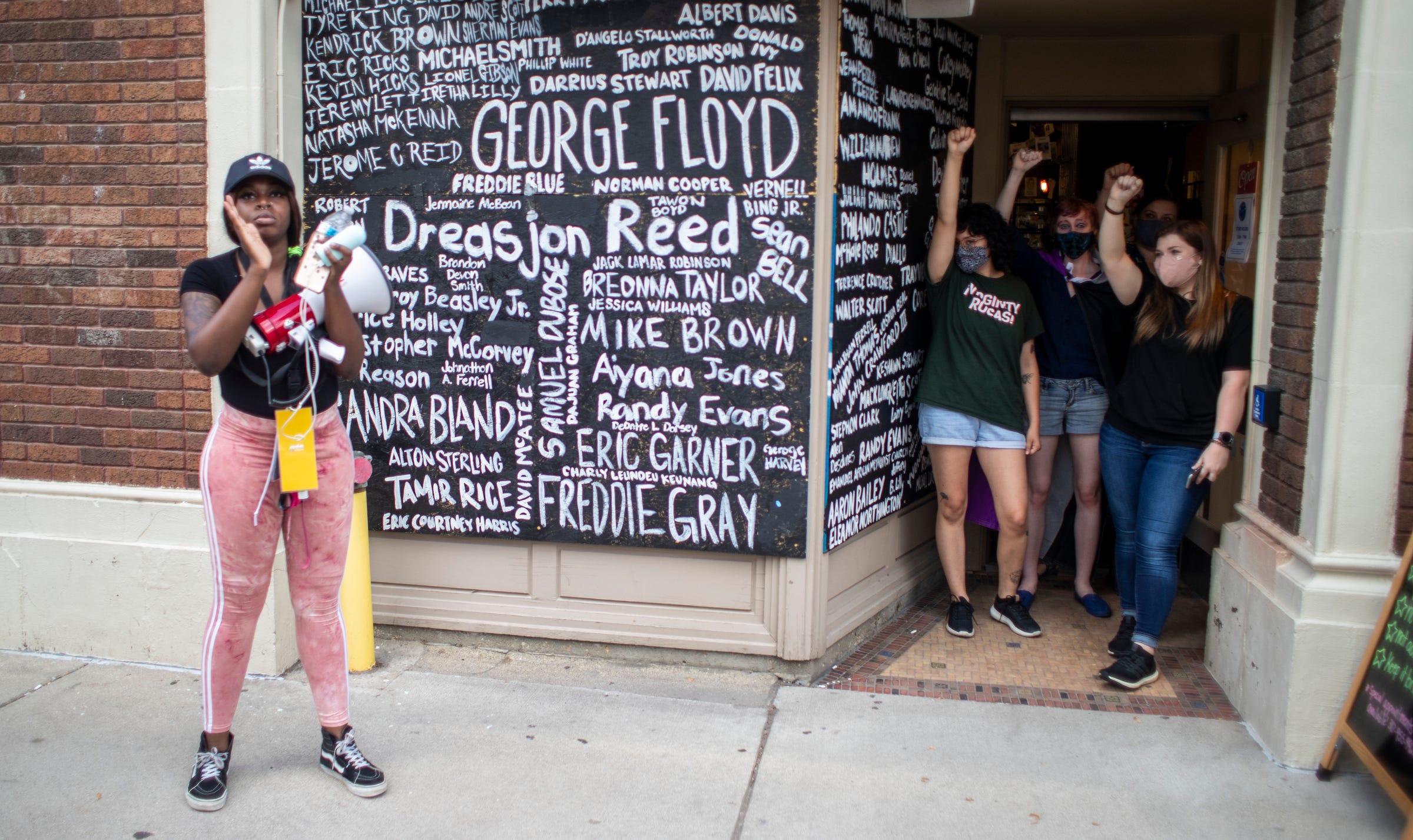 In 13th day of protests, crowd cheers release of police officer names