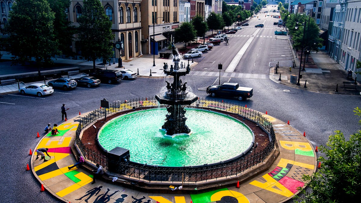 Black Lives Matter is painted around Court Square Fountain