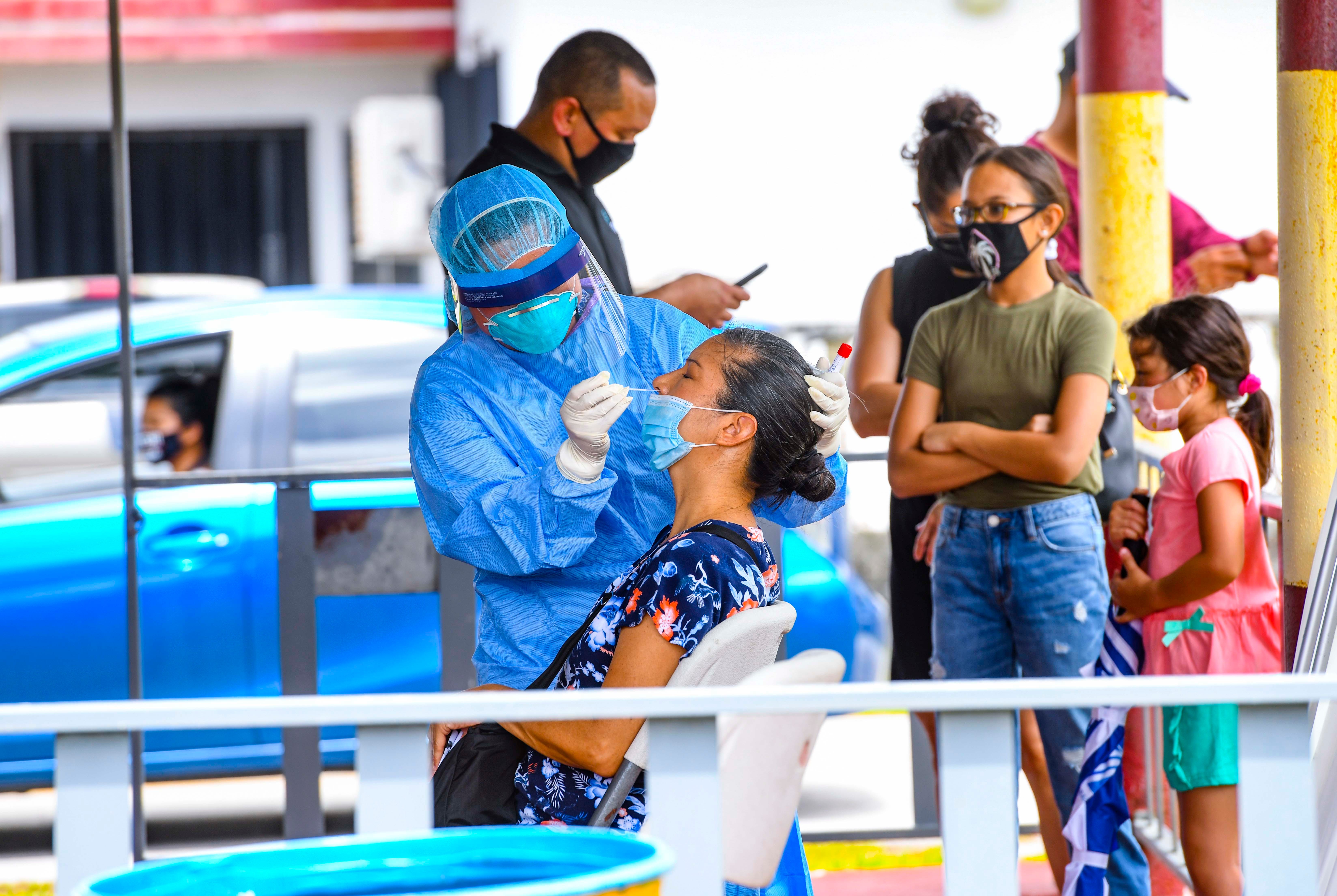 Doctors still recommend wearing a mask and social distancing
