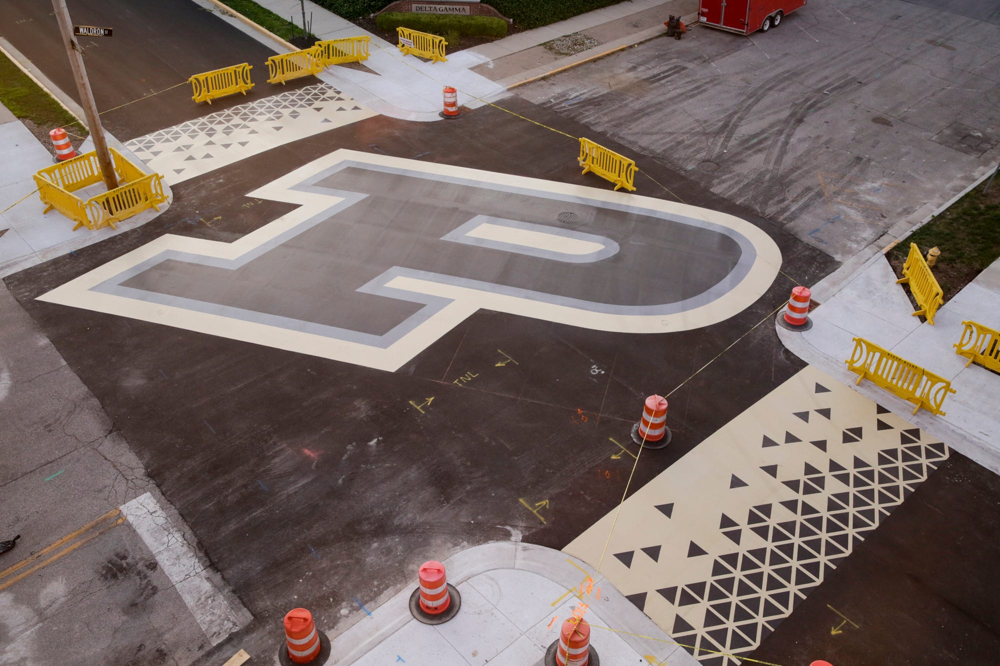 Purdue murals take shape on Third Street’s new, no-car look on campus