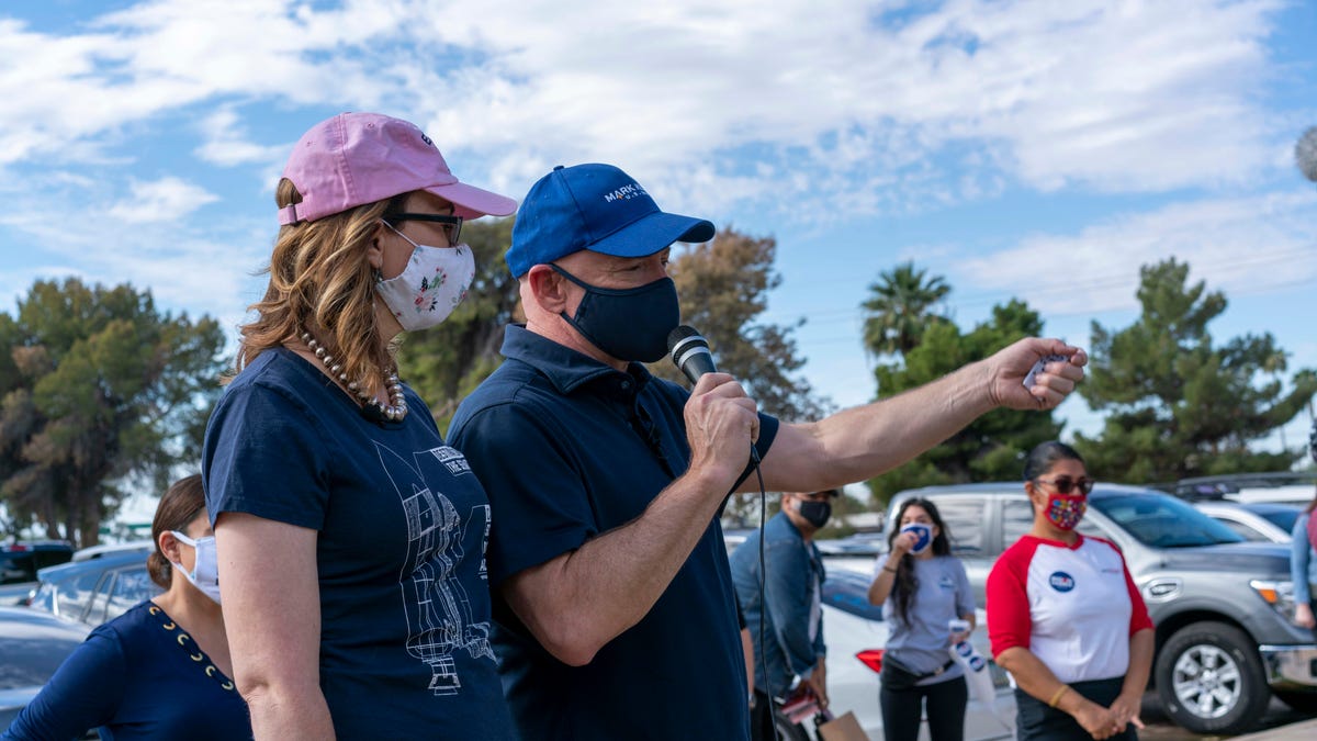 Mark Kelly campaigns with wife Gabby Giffords in west Phoenix