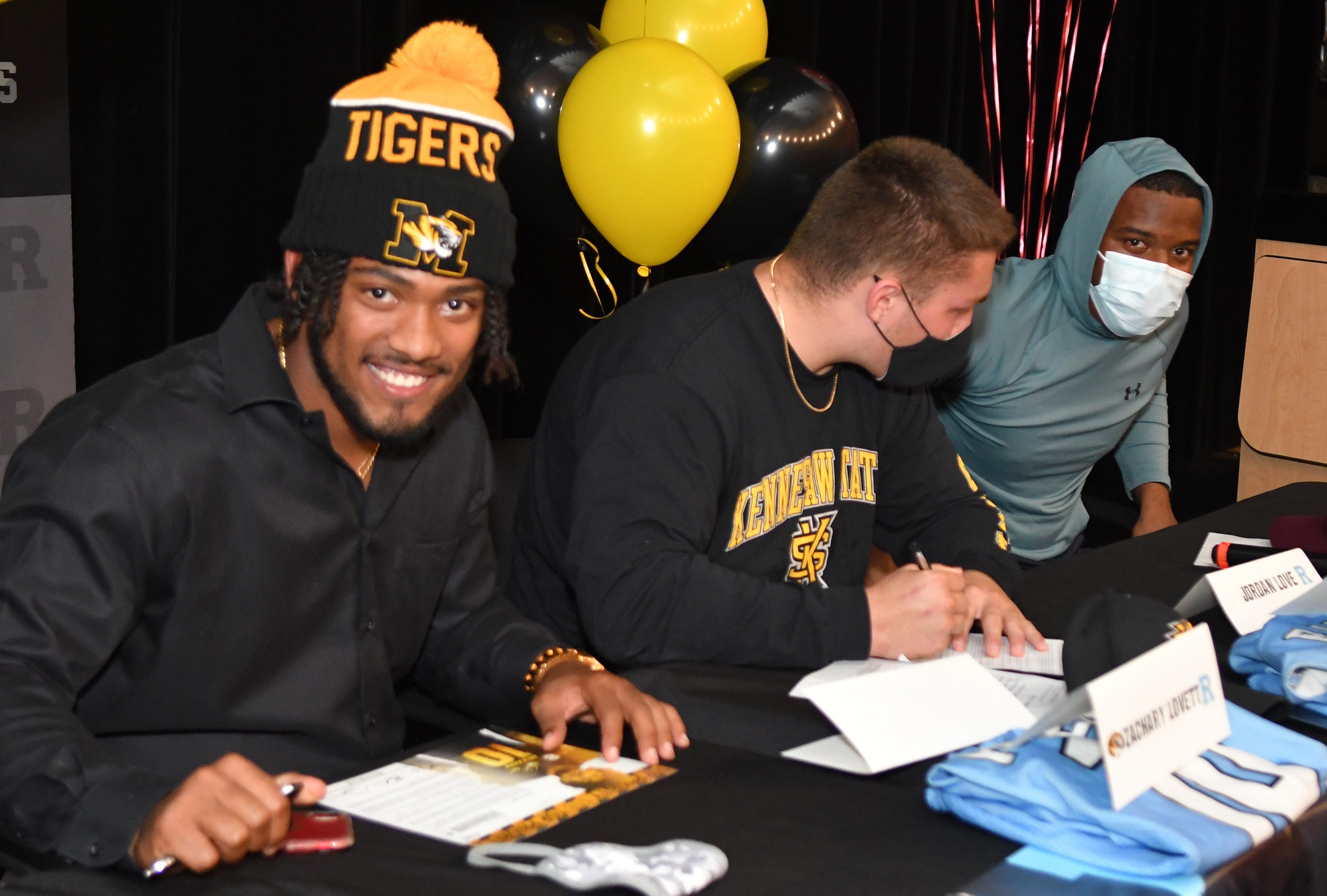 Early signing day: HS senior football players sign with colleges