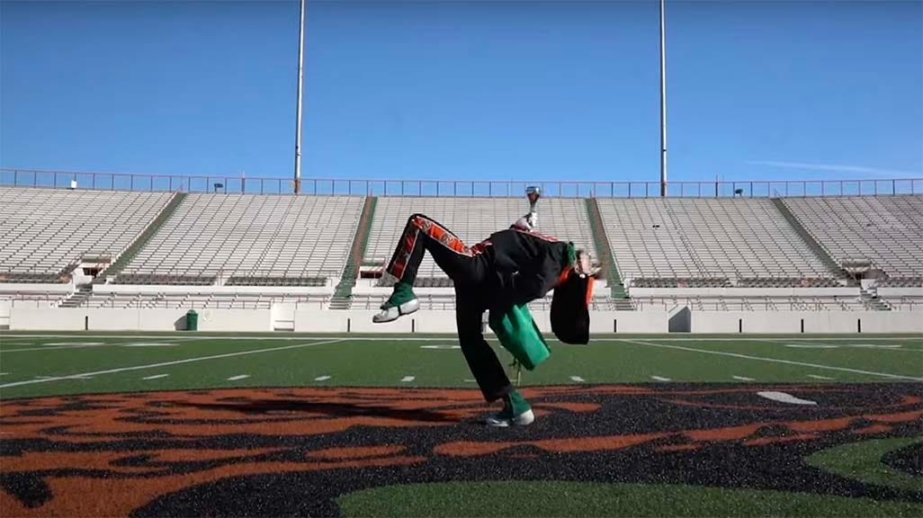‘Incomparable’ Marching 100 drum major steps up in NCAA half-time ...